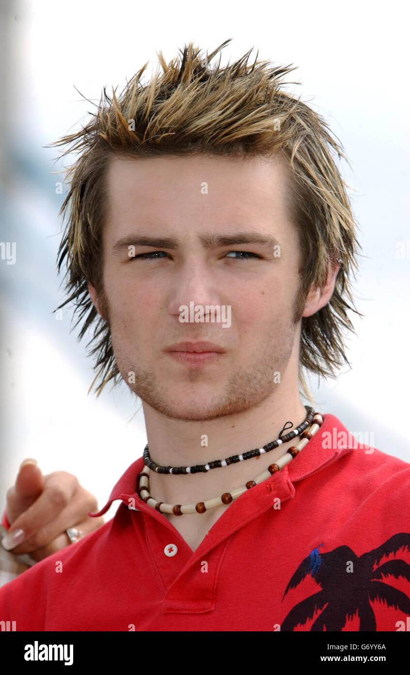 Harry from pop band McFly poses for photographers during a photocall to ...