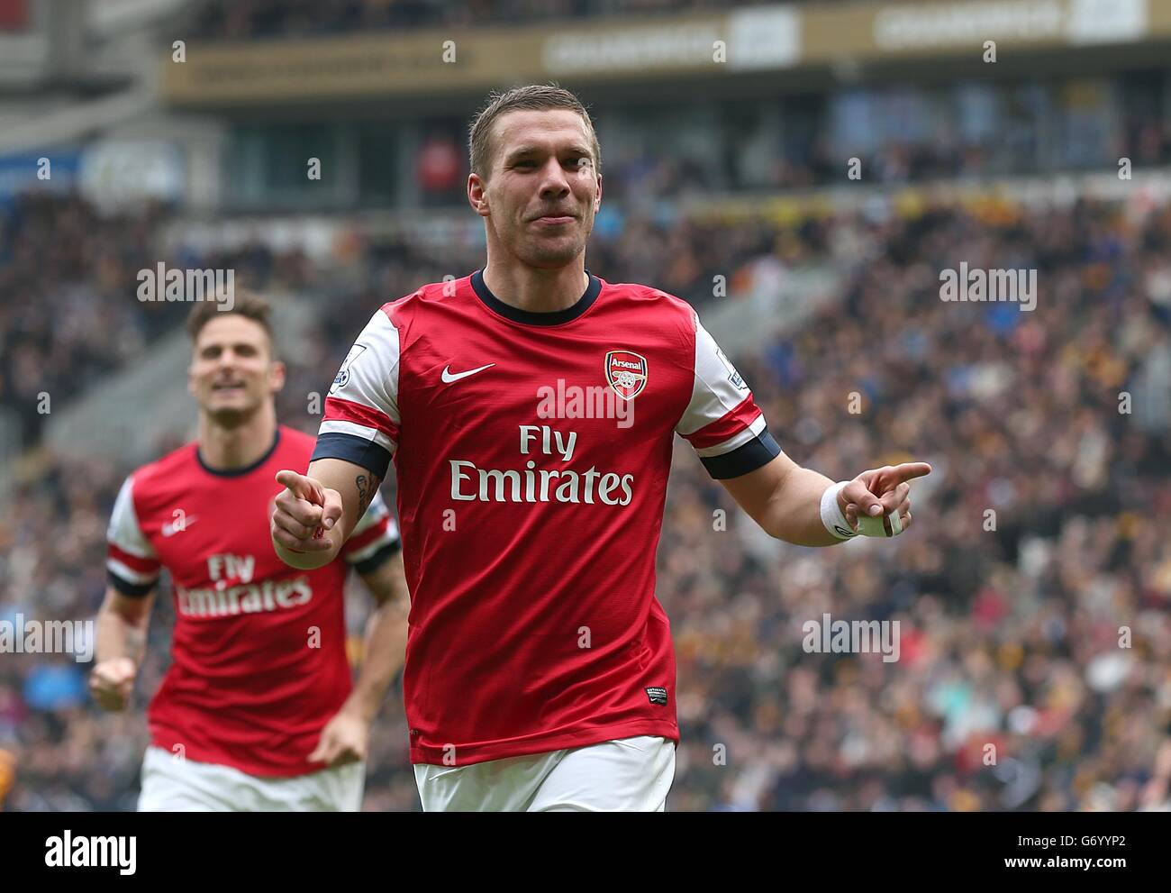 Arsenal's Lukas Podolski celebrates scoring his side's third goal Stock ...