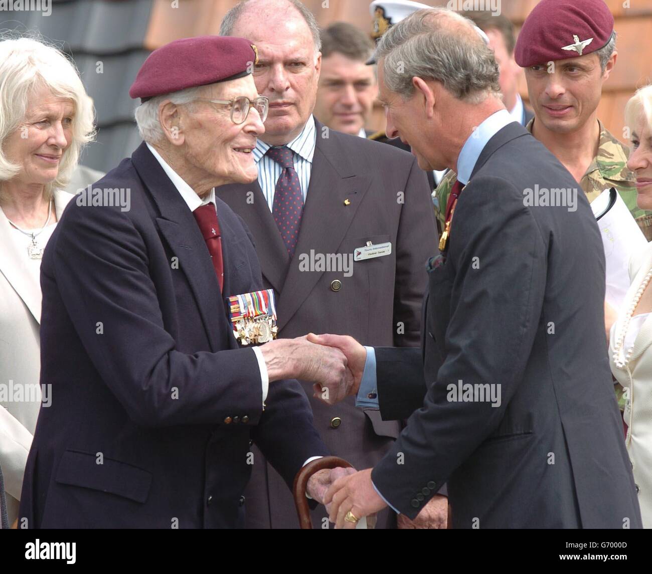 The Prince of Wales greets Brigadier Sir James Hill, before unveiling a ...