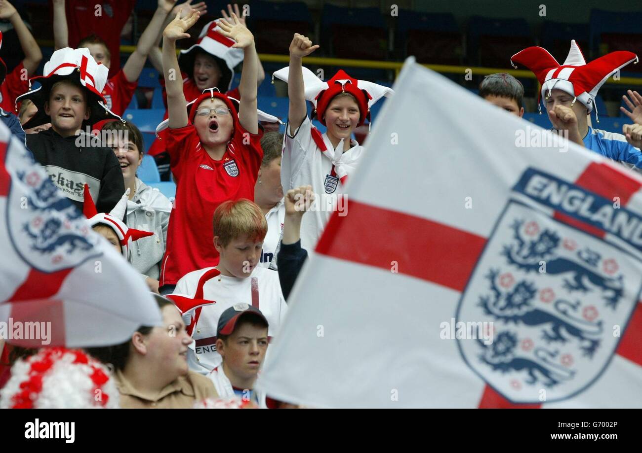 Young England fans cheer on their team before the start of the ...