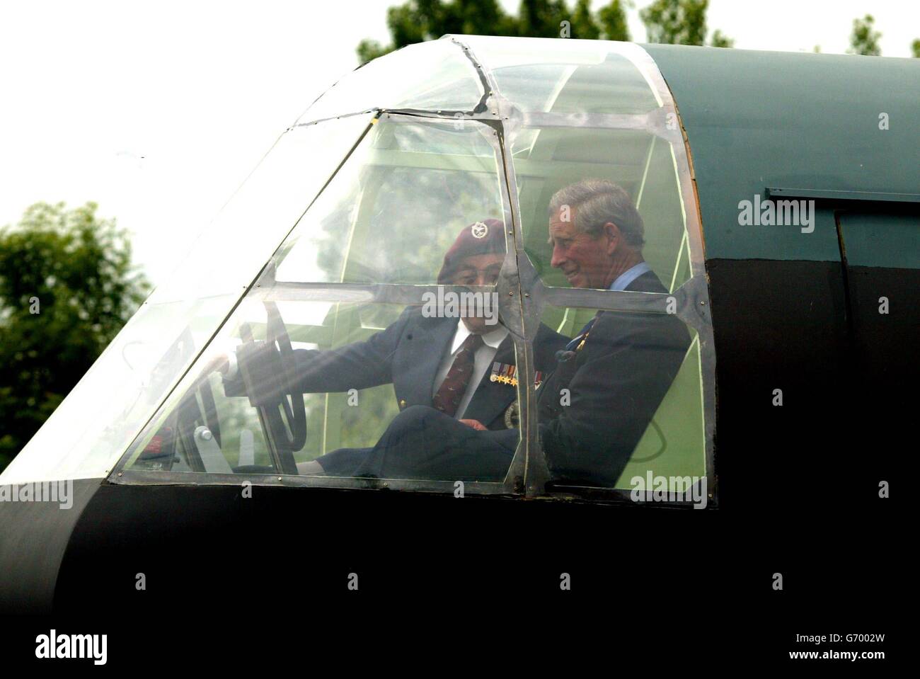 The Prince of Wales sits with veteran pilot Jim Wallwork inside a ...