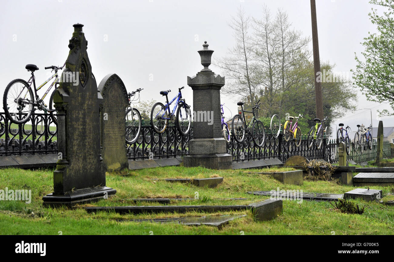 A line of bicycles are left on the railings of a cemetery in Calderdale ...