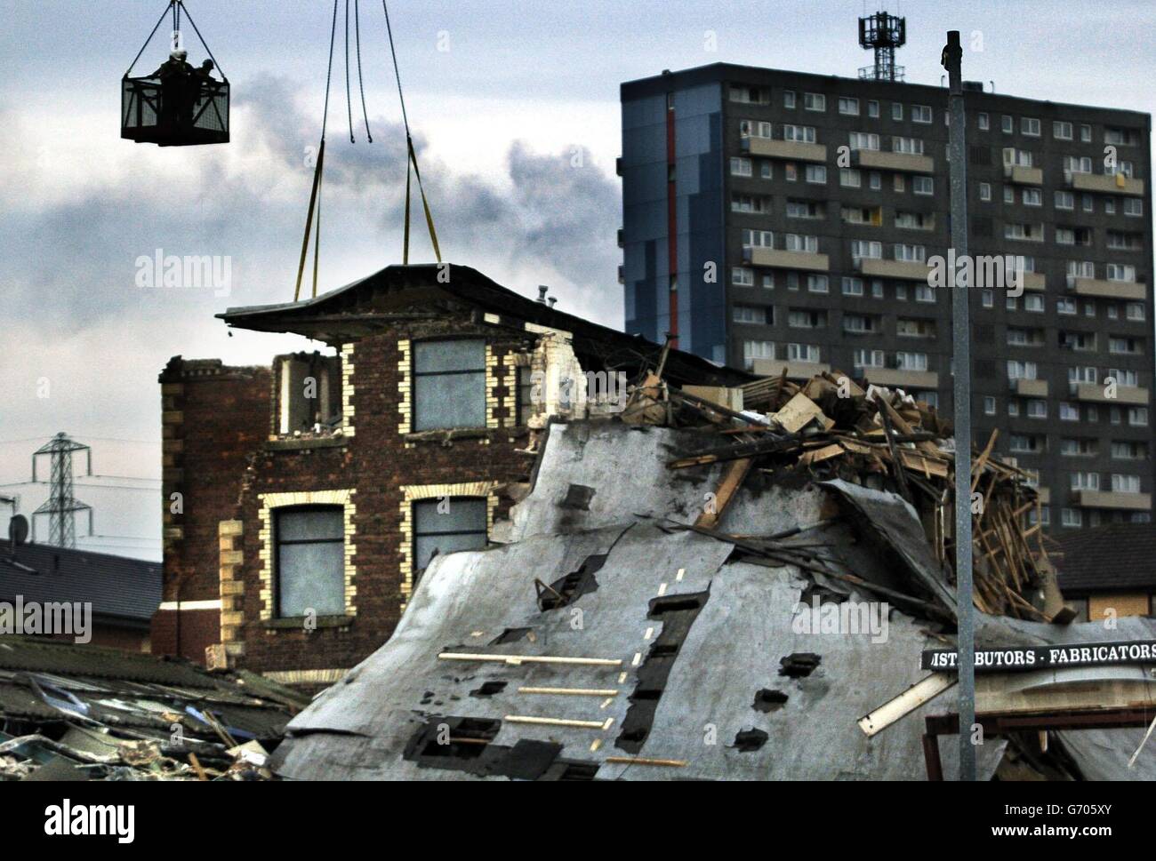 The roof is raised from the collapsed building at the Stockline ...