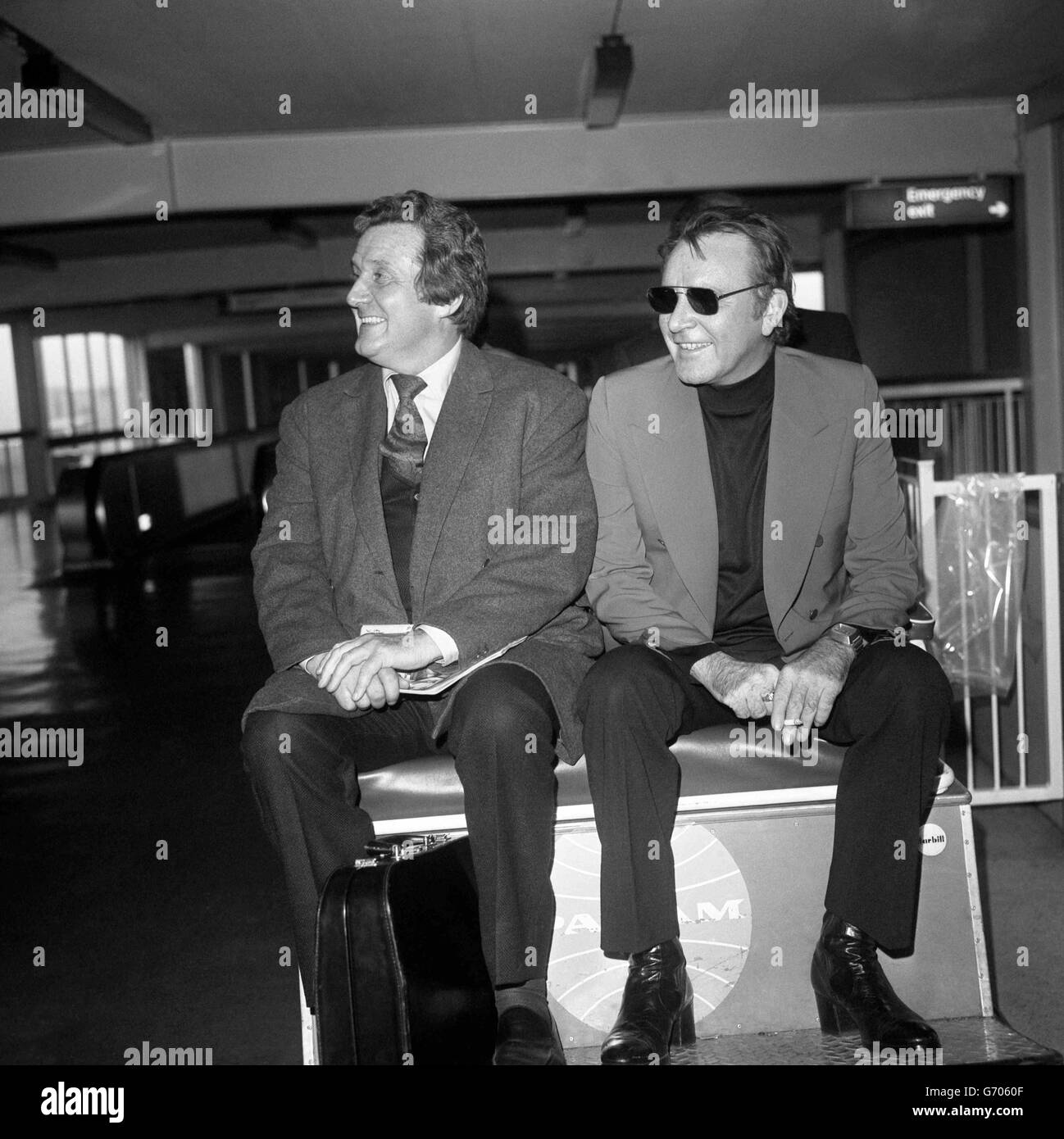 Richard Burton waits with fellow actor Patrick Macnee at Heathrow ...