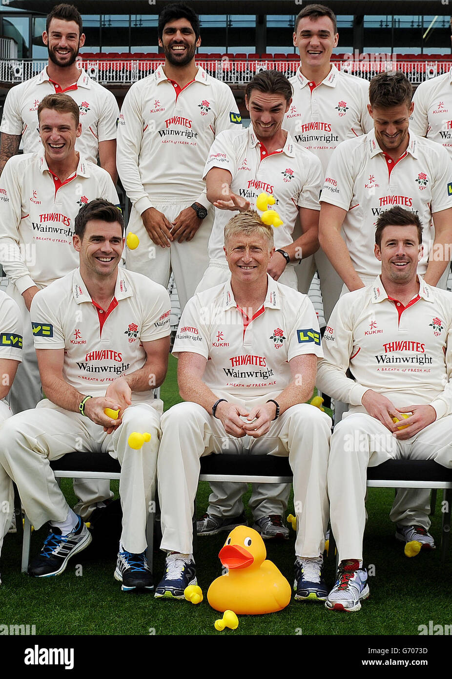 Lancashire County Cricket club's Oliver Newby (centre) throws toy ducks ...
