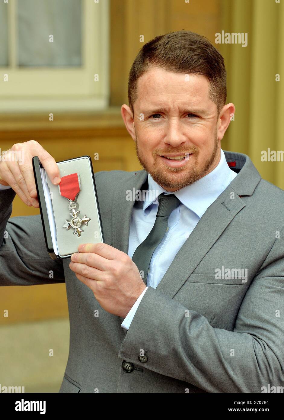 Shane Williams holds his MBE (Member of the British Empire), after it ...