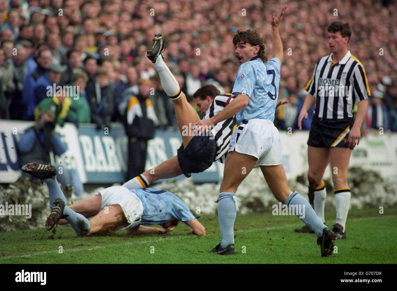 Manchester City's Gary Megson takes out Notts County's Phil Turner on ...