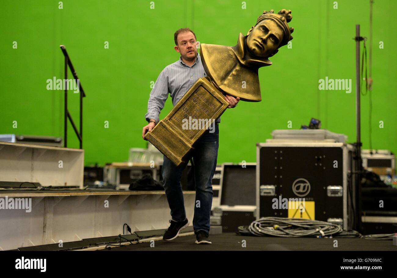 Lee Batty, Head of Production for the Olivier Awards, moves a model of ...