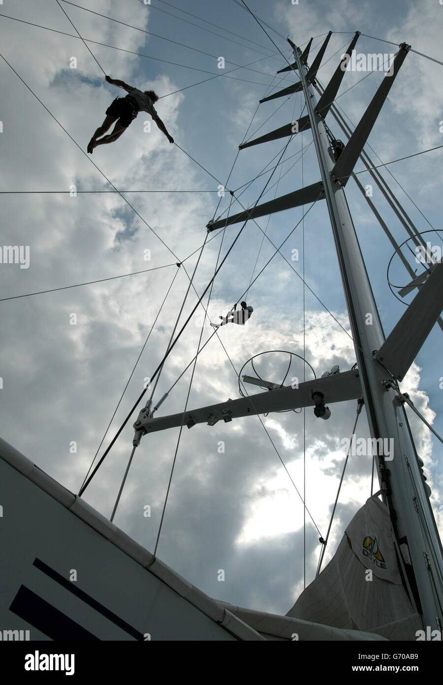 Crew members put the finishing touches to the rigging of the world's ...