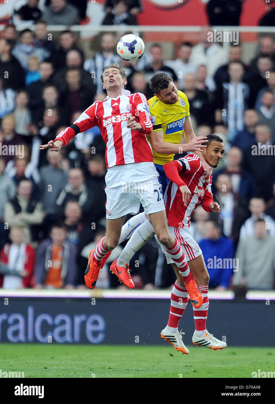 Stoke City's Peter Crouch (left) and Newcastle United's Paul Dummett ...