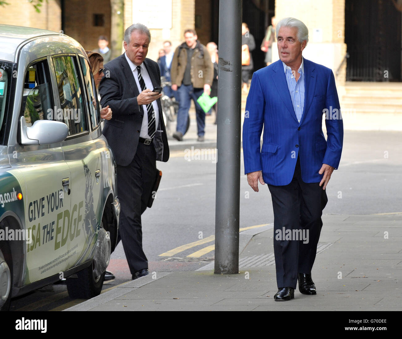 Publicist max clifford right arrives by taxi with his team hi-res stock ...