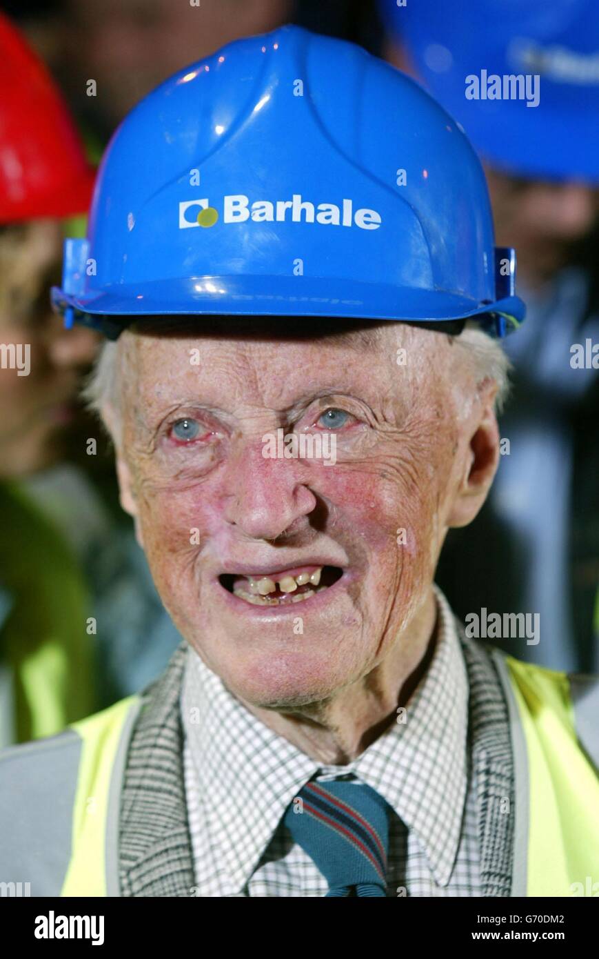 Second World War pilot Sergeant Ray Holmes (R), looks at a peice of the ...