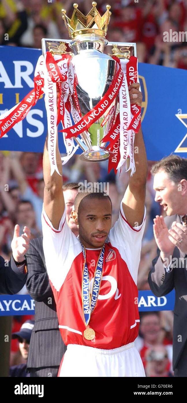Arsenal's Thierry Henry celebrates with the Barclaycard Premiership ...