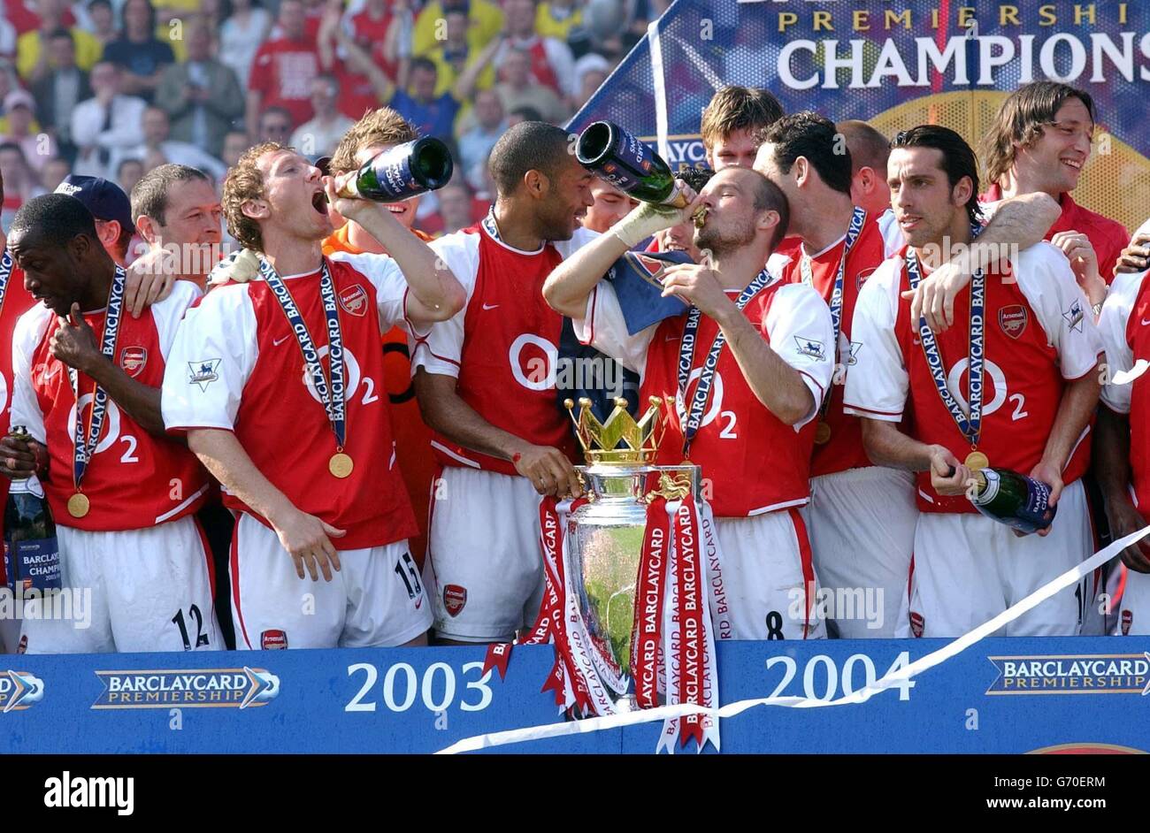Arsenal players champagne celebrations begin after they are presented ...