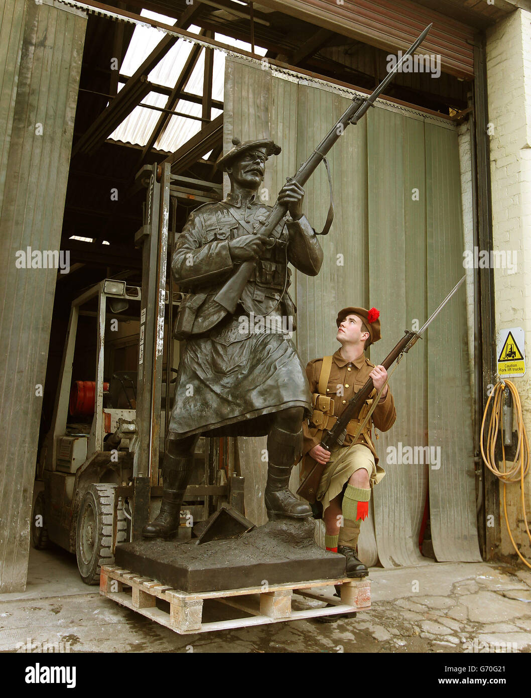 Serving Black Watch Soldier Arron Kelly from Edinburgh stands beside a ...
