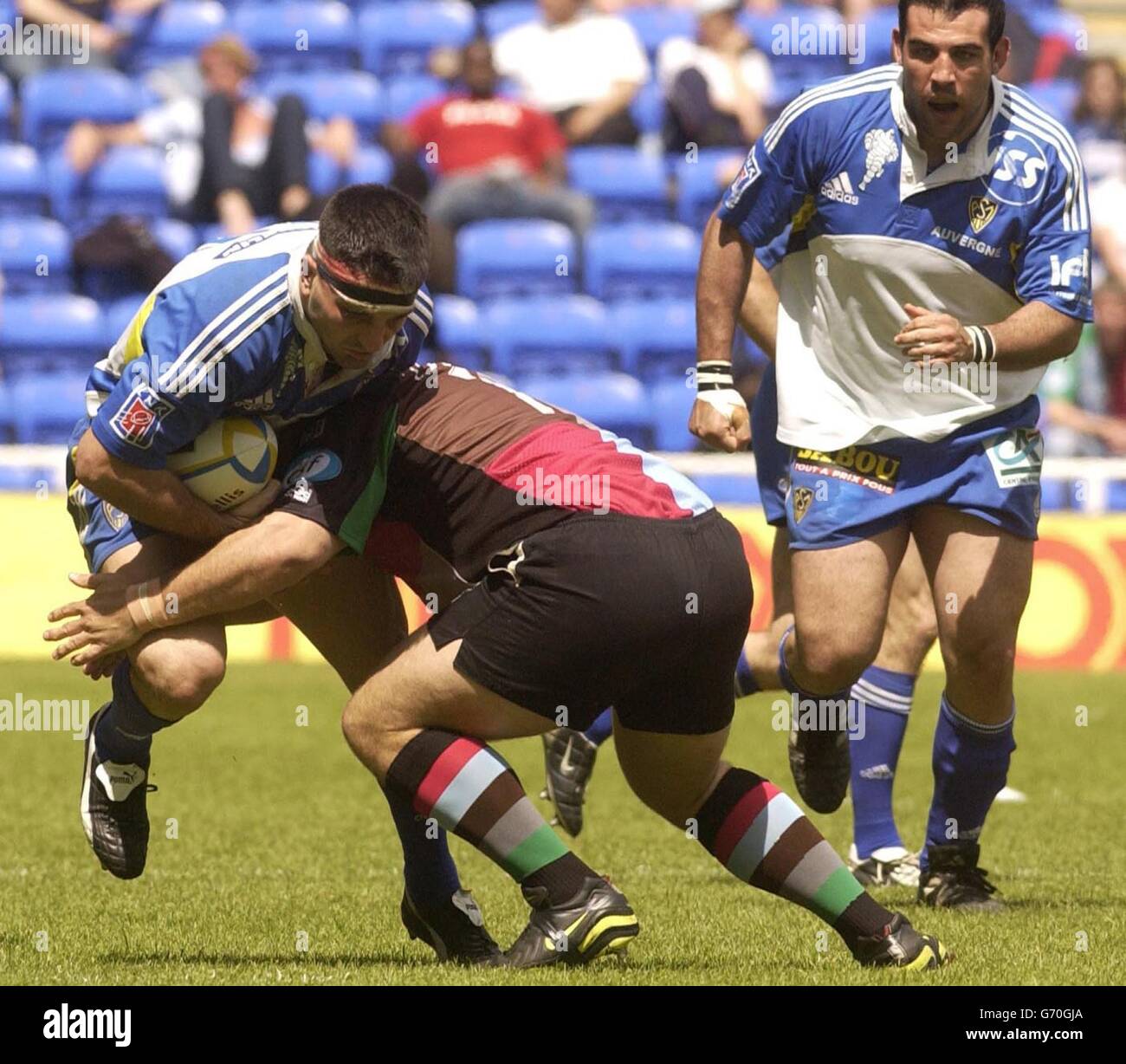 Montferrand's Raphael Chanal is taken down by Harlequins' Jason Leonard ...