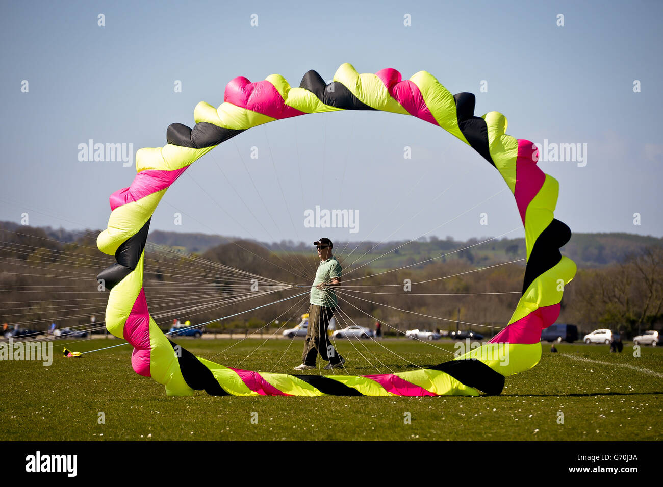 Kite flyer Alan Pinnock launches his pair of circular kites in the mild ...