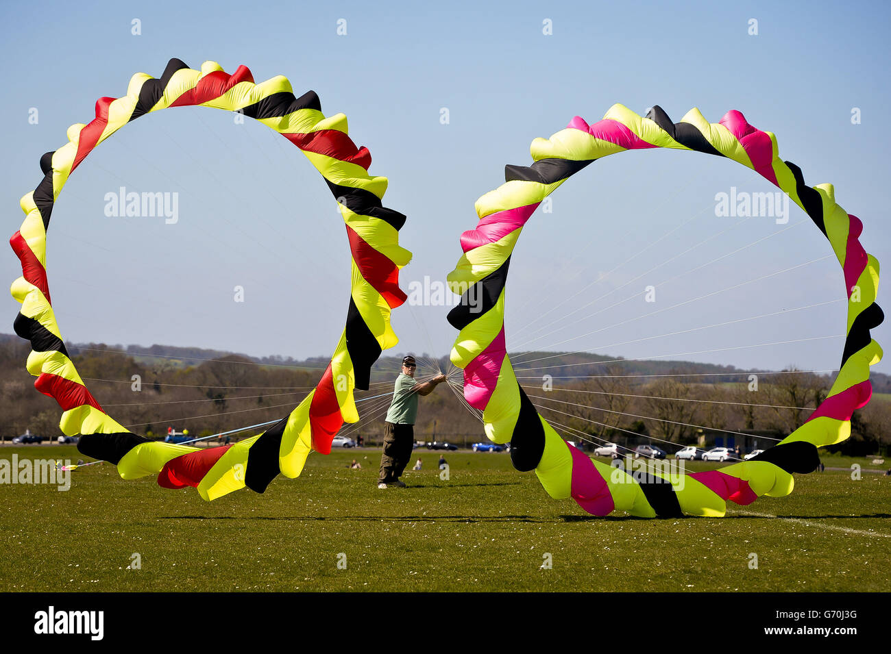 Kite flyer Alan Pinnock launches his pair of circular kites in the mild ...