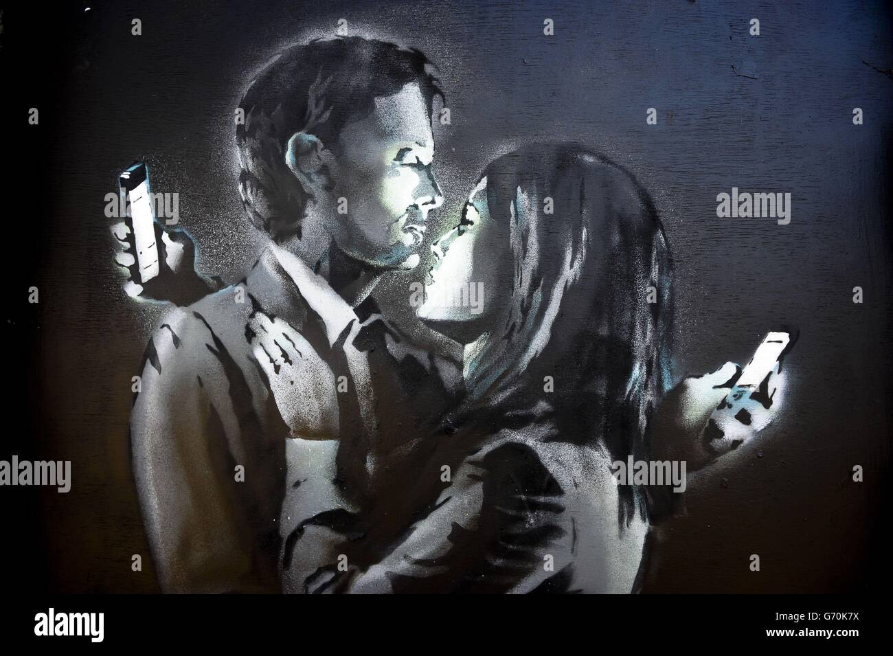Mobile lovers banksy hi-res stock photography and images - Alamy