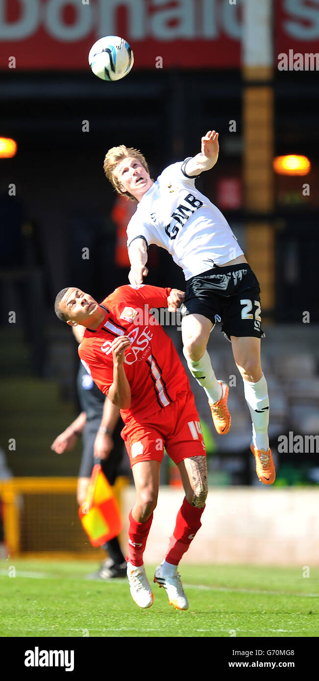 Port Vale's Ryan Lloyd out jumps Milton Keynes Dons' Dele Alli during ...