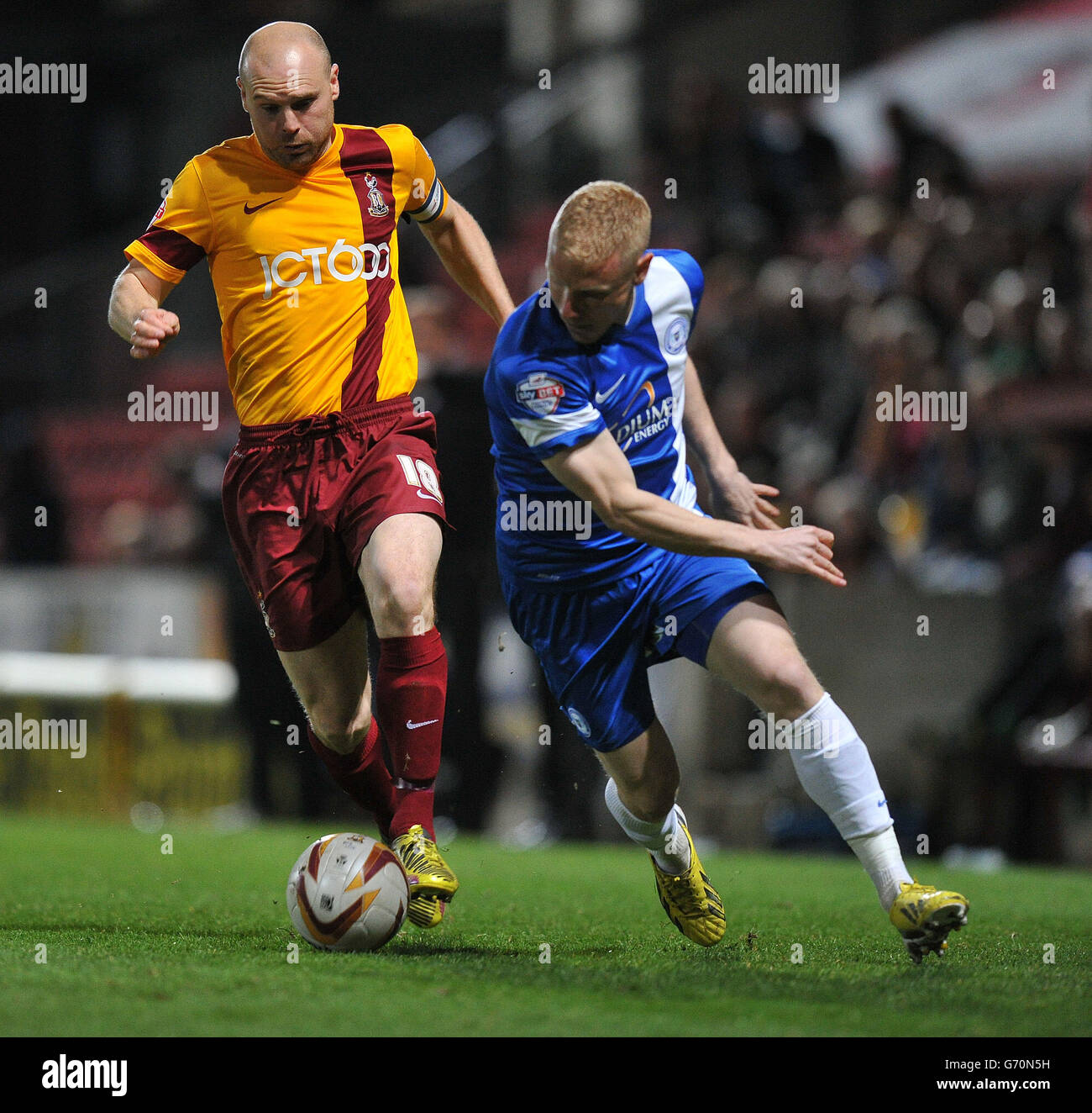 Bradford City's Gary Jones and Peterborough United's Craig Alcock ...