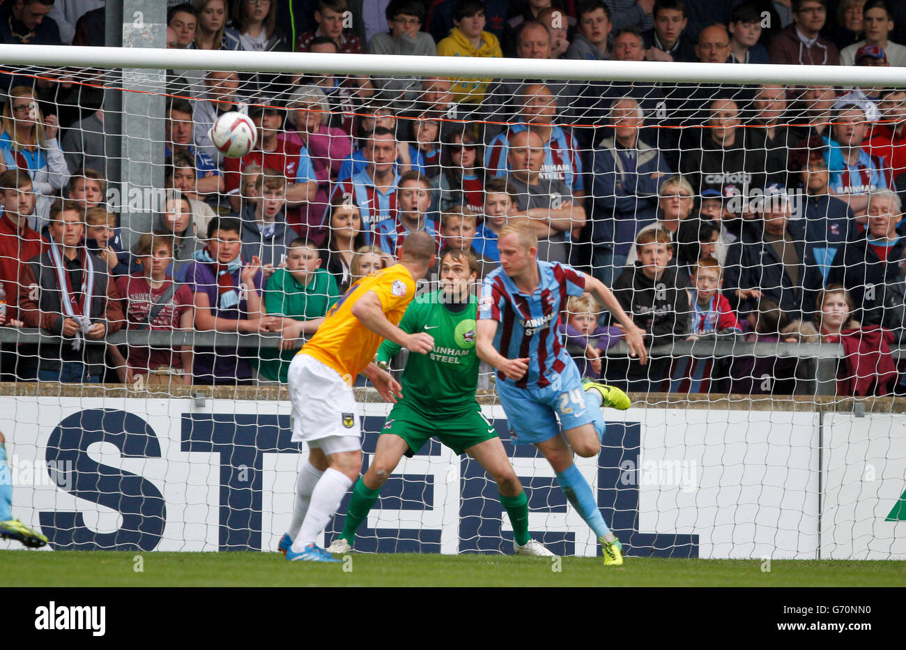 Oxford's James Constable (left) goes close with a second half header ...