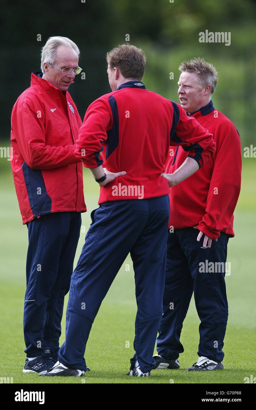 England's Manager Sven-Goran Eriksson (left) talks with his coaches ...