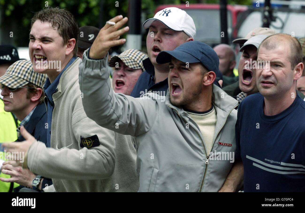 Right wing protesters shout at Muslims during Friday prayers outside a ...