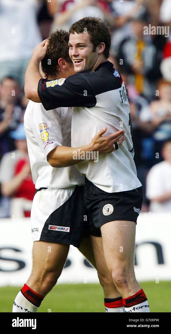 Widnes Vikings' Simon Finnigan shares his delight with his team-mate ...