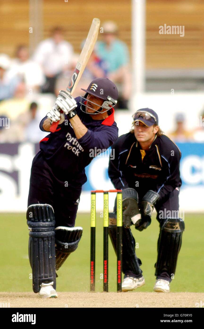 Middlesex Crusaders' Paul Weekes (left) hits a four off the bowling of ...