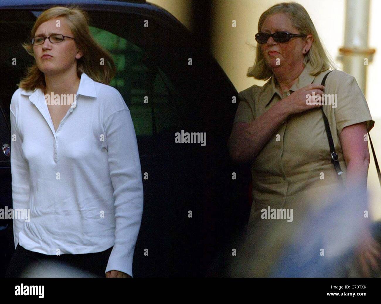 Sue Dickinson (right), 46, arrives with her younger daughter Jenny, 19 ...