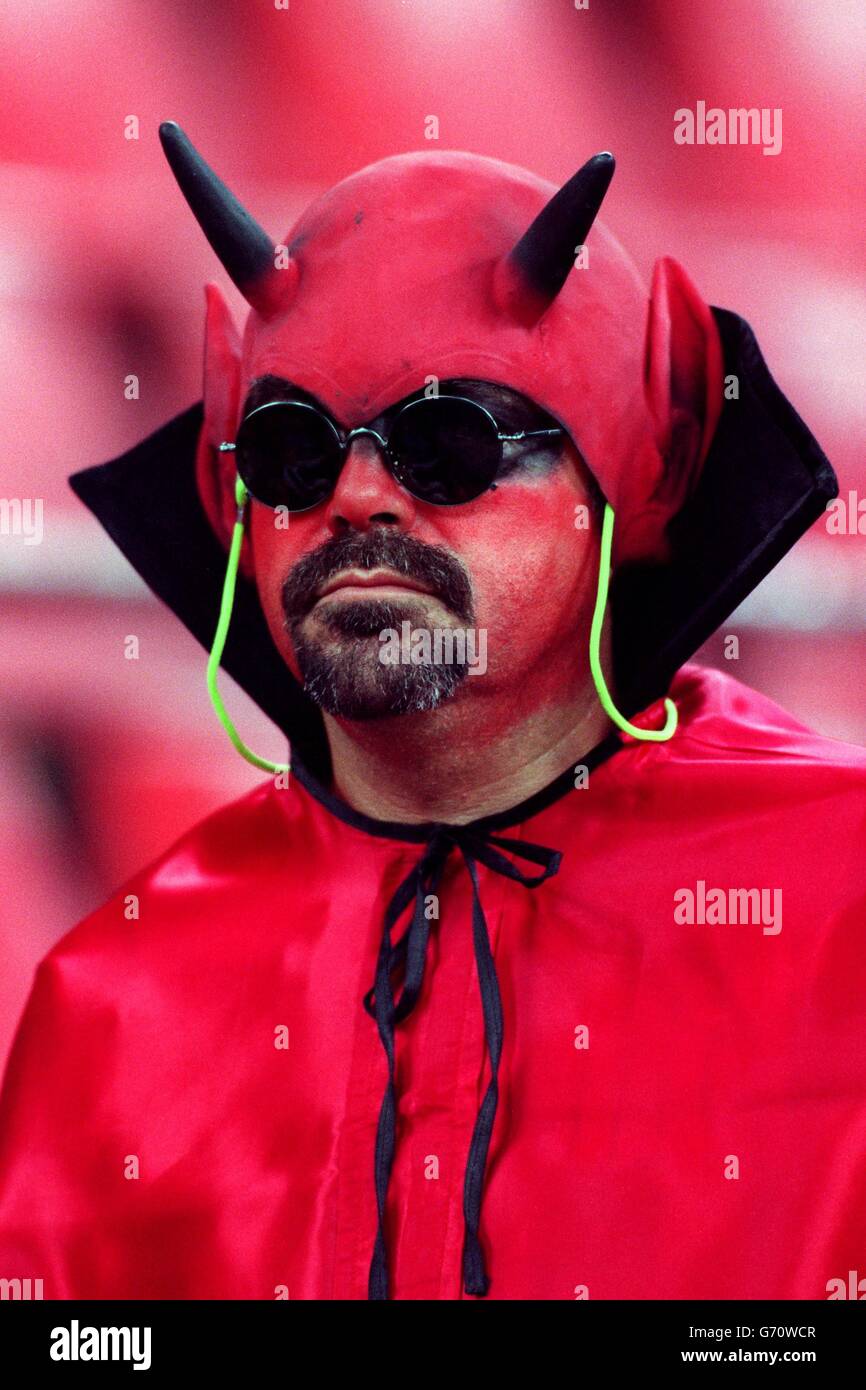 An ac milan fan dressed as the devil hi-res stock photography and ...
