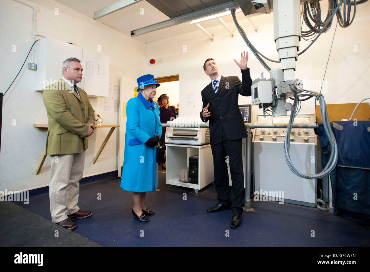 Queen Elizabeth II looks at an equine x-ray machine during an official ...