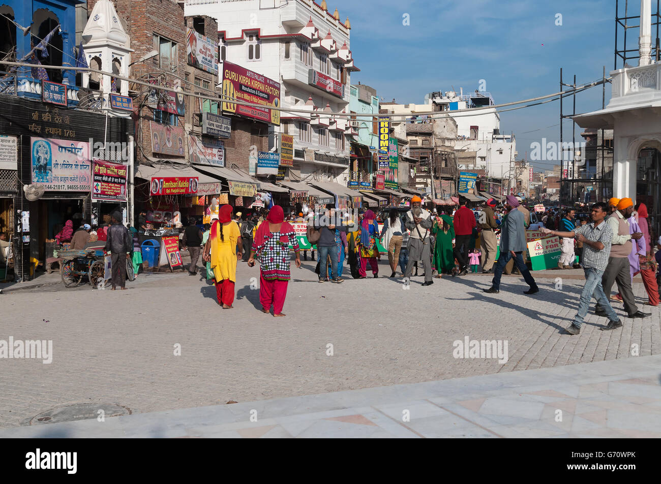 On the street. in Amritsar, Punjab. It is home to the Harmandir Sahib ...