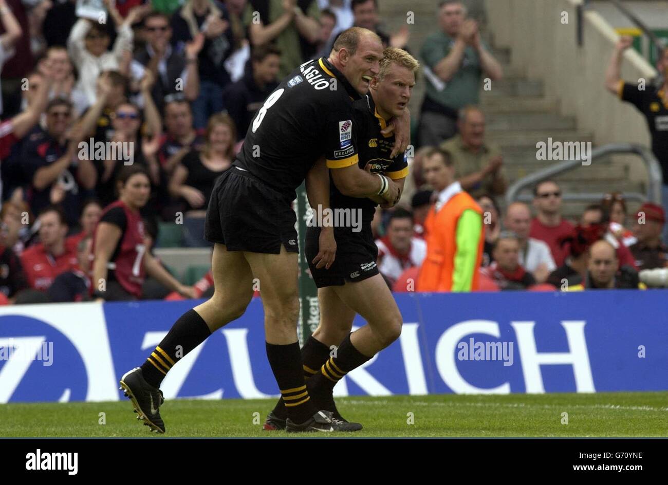 Wasps captain Lawrence Dalaglio congratulates Stuart Abbott, scorer of ...