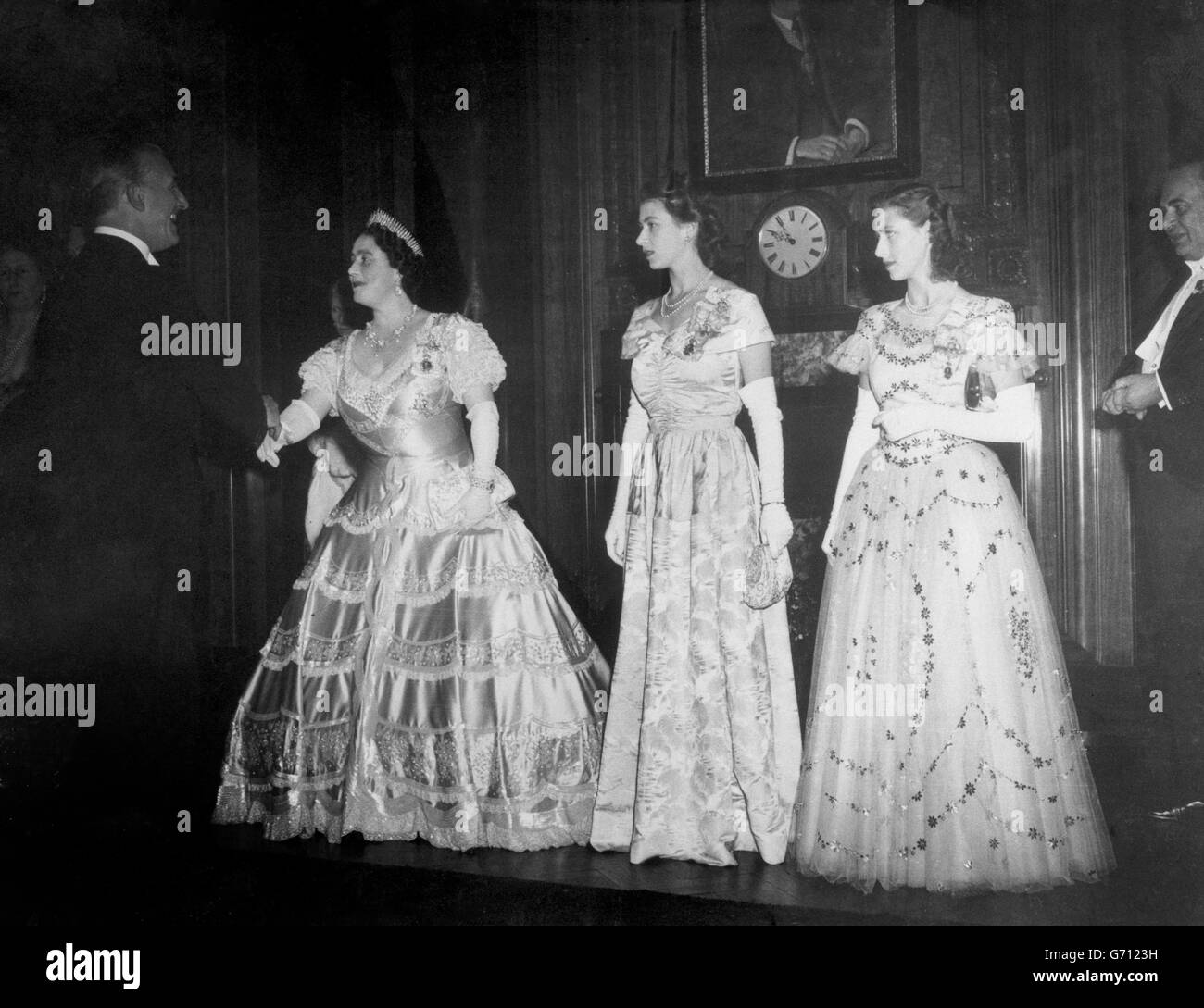 The Queen, Princess Elizabeth (centre) and Princess Margaret greet one ...