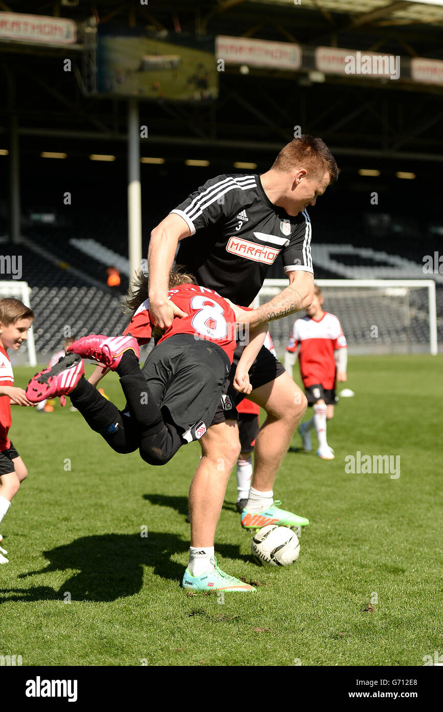 Fulham's Jon Arne Riise takes part in a coaching session for the Junior ...