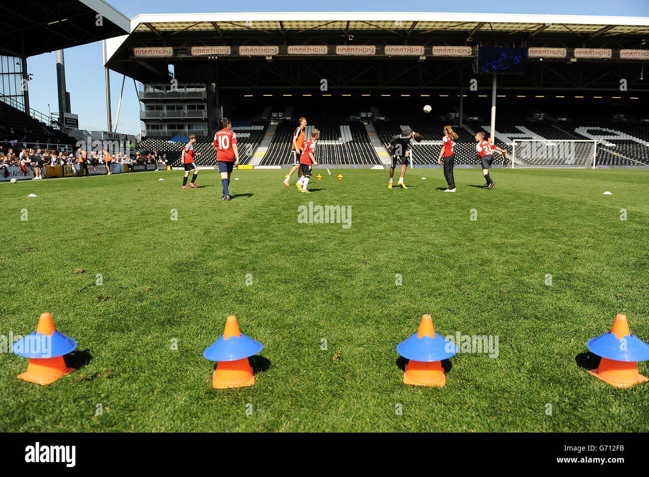 Action from a coaching session for the Junior Fan Squad Stock Photo - Alamy