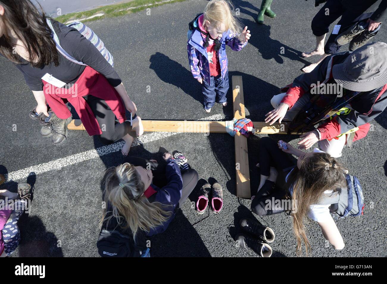 Pilgrims cross from Beal sands to the Holy Island of Lindisfarne in ...