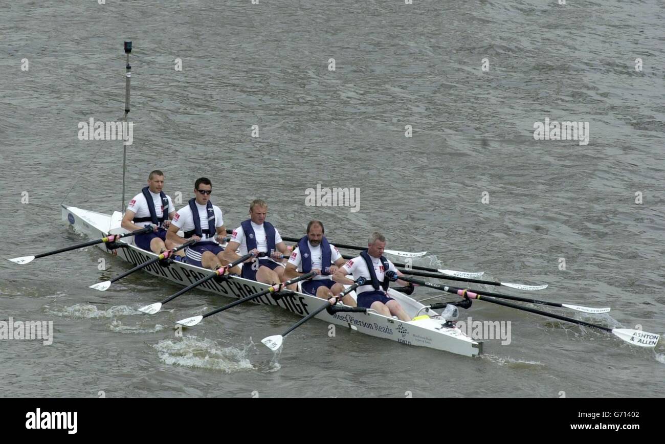 Five rowers pass beneath Westminster Bridge in London, as they attempt ...