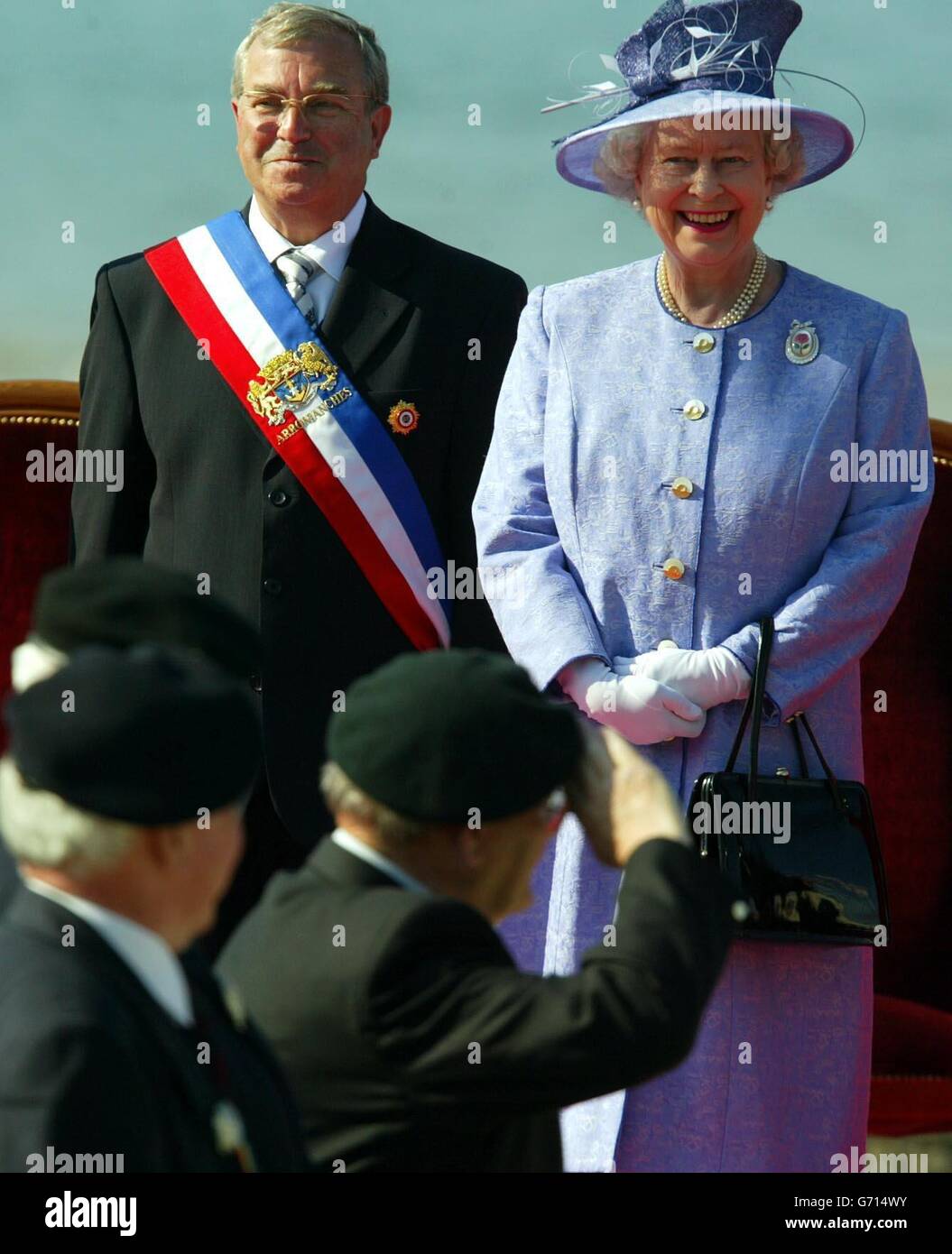 Britain's Queen Elizabeth II and the Mayor Patrick Jardin take the ...
