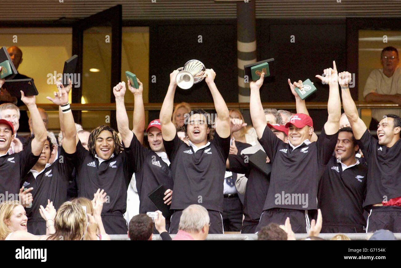 New Zealand players celebrate with the IRB Rugby Sevens trophy after ...