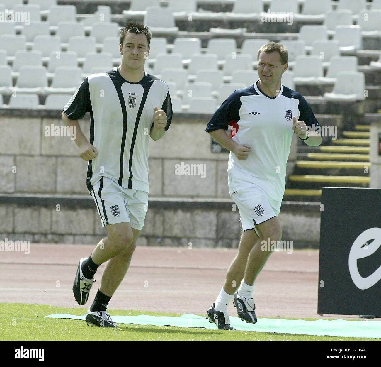 England defender John Terry takes part in a light training session with ...