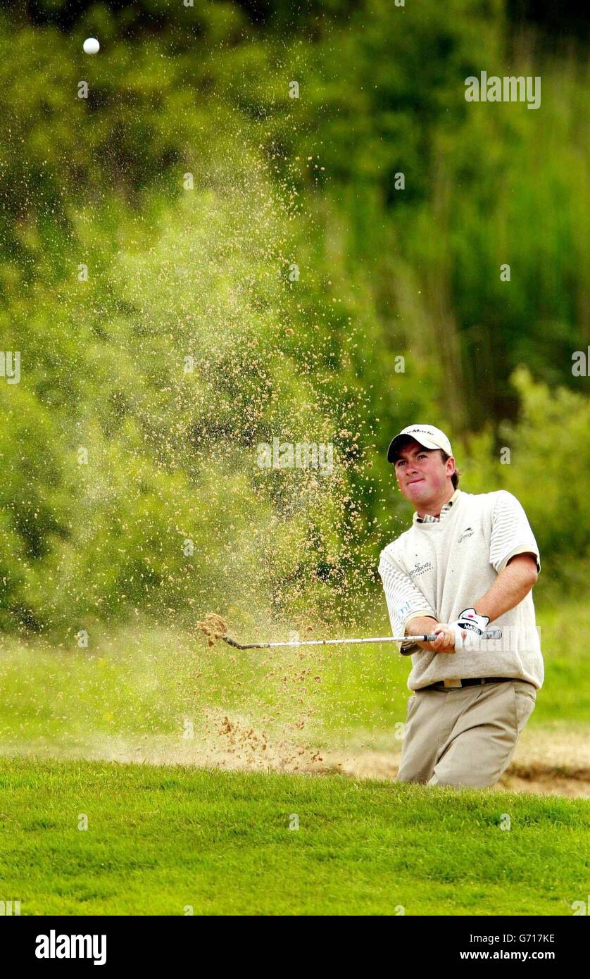 Scotland's Graeme McDowell plays out of the bunker and on the 18th hole ...