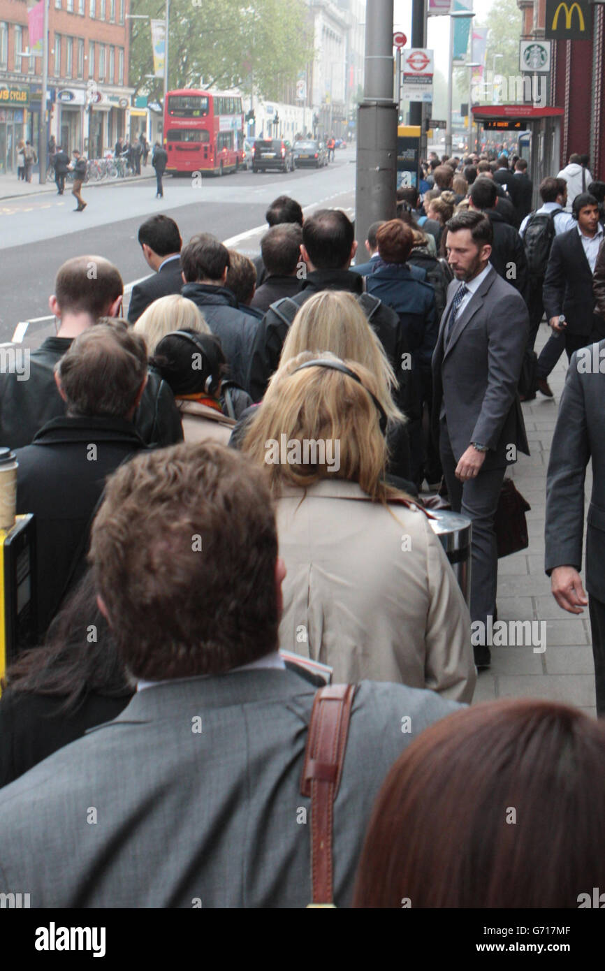 The back of a long queue for a bus outside Waterloo station, London, on ...