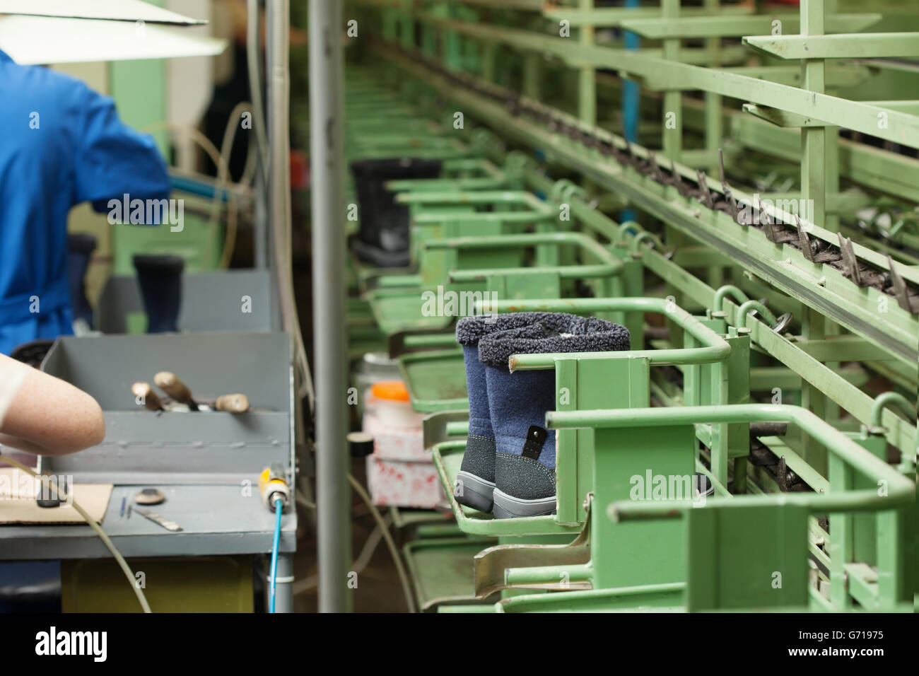 Production of blue demi-season boots Stock Photo - Alamy