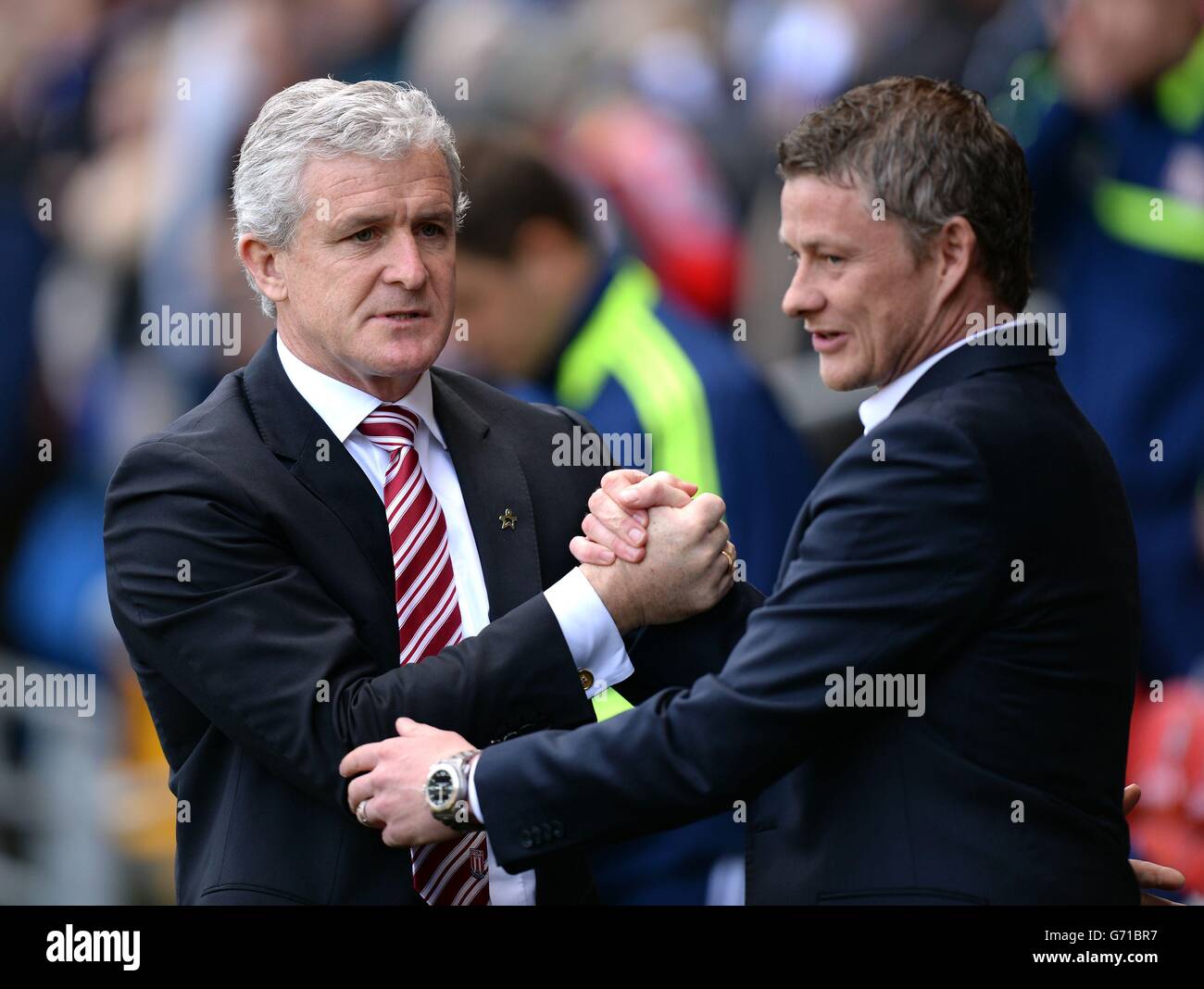 Cardiff City manager Ole Gunnar Solskjaer (right) shakes hands with ...
