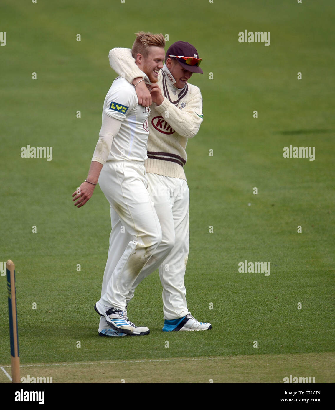Surrey's Matthew Dunn (left) celebrates taking the wicket of Essex's ...