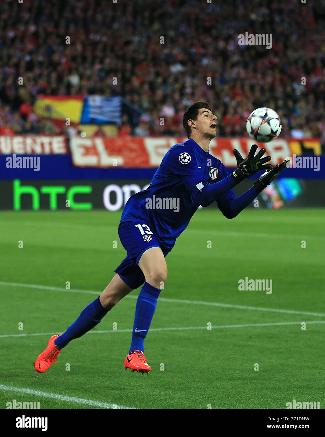 Atletico Madrid goalkeeper Thibaut Courtois takes a catch Stock Photo ...