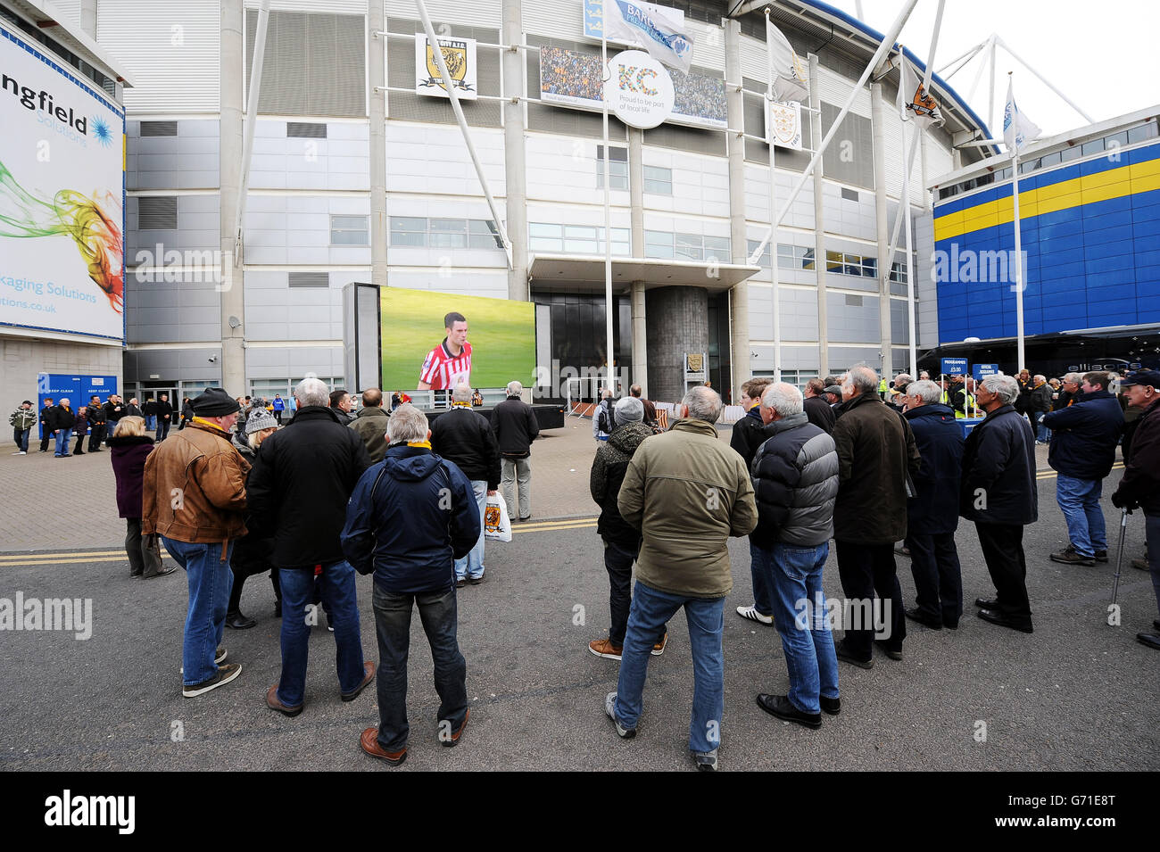 A general view of fans outside the ground watching a large screen Stock ...